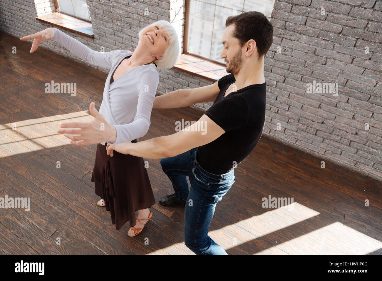 Enjoying every dance movement. Optimistic graceful passionate dance ...