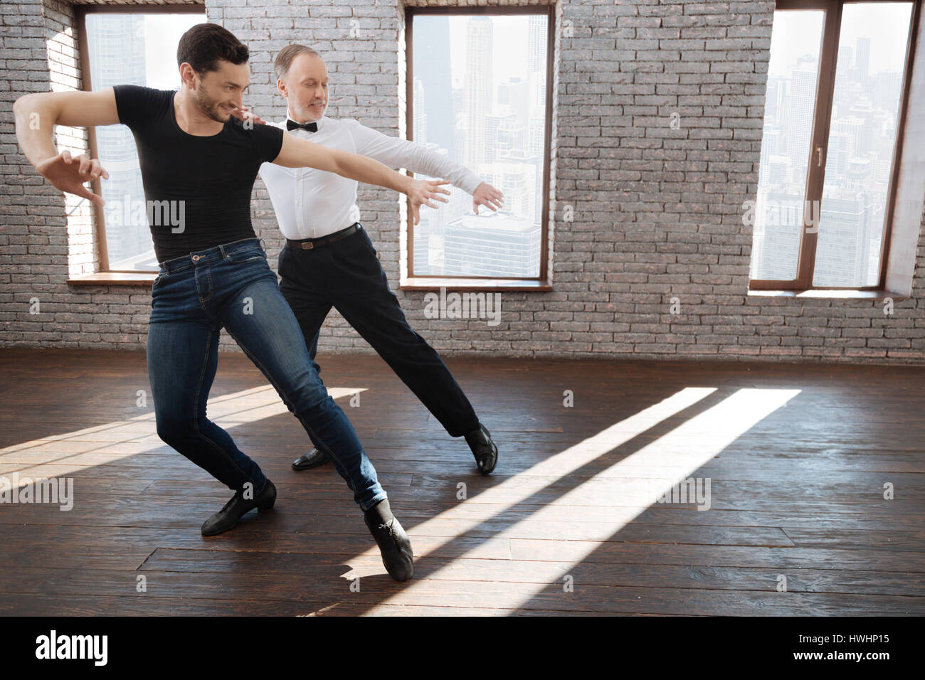 Mastering right dance position of legs. Positive gifted professional ...