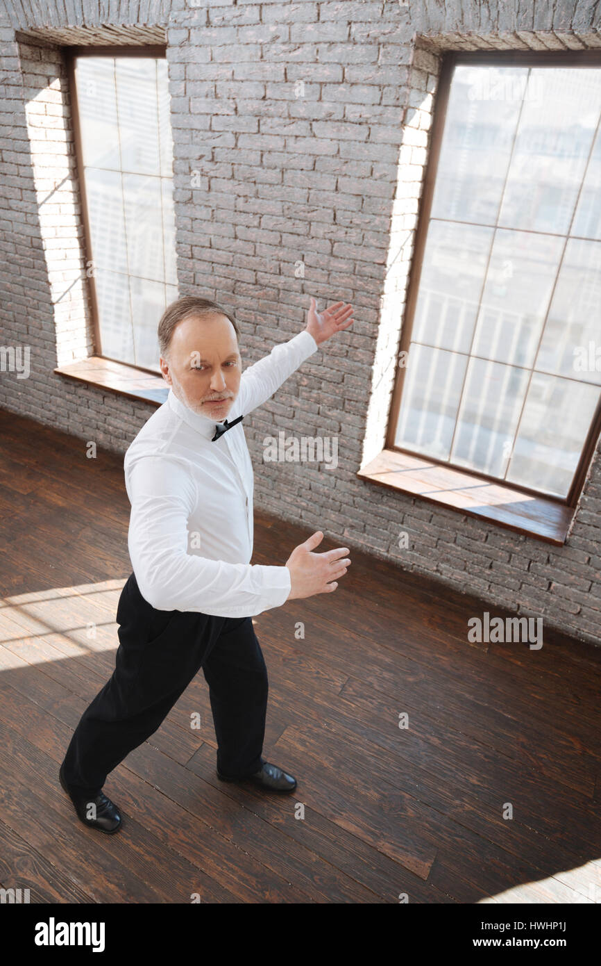 Enjoying dance rehearsal . Gifted inspired aging man performing in the ...
