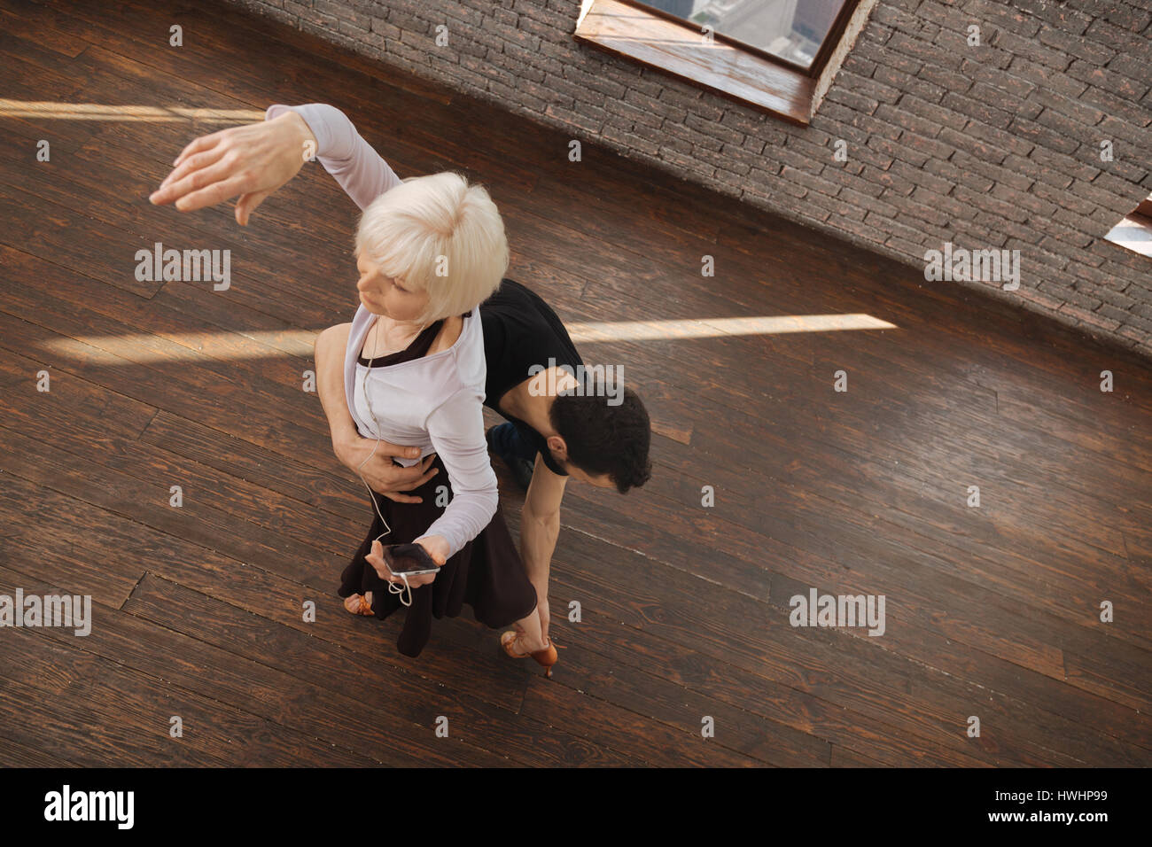 Mastering art step. Professional athletic attentive dance instructor ...