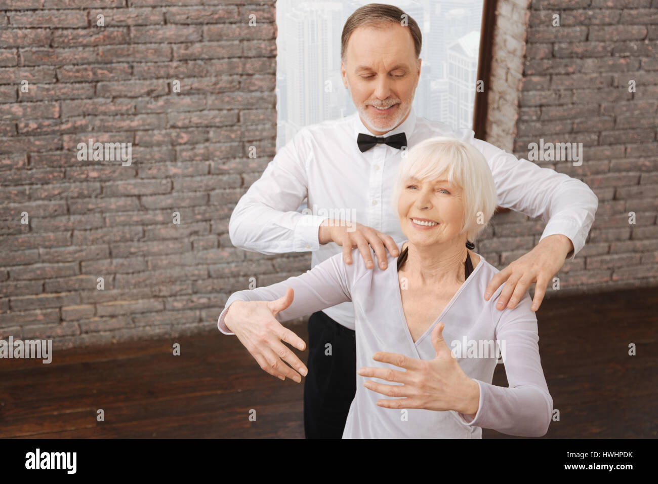 Thinking about beautiful posture. Thoughtful positive skillful senior ...