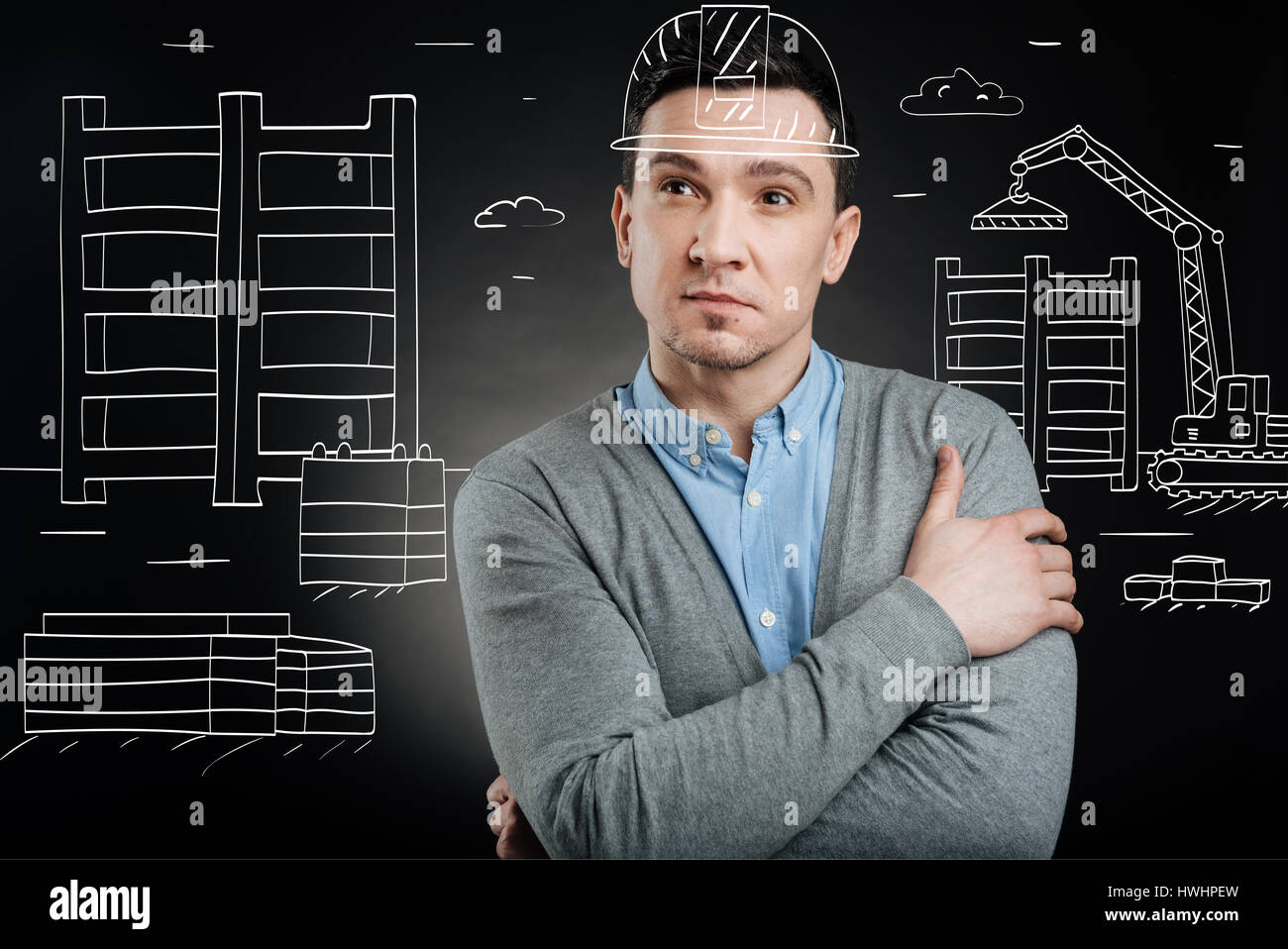 Responsible work. Concentrated construction engineer standing on the ...