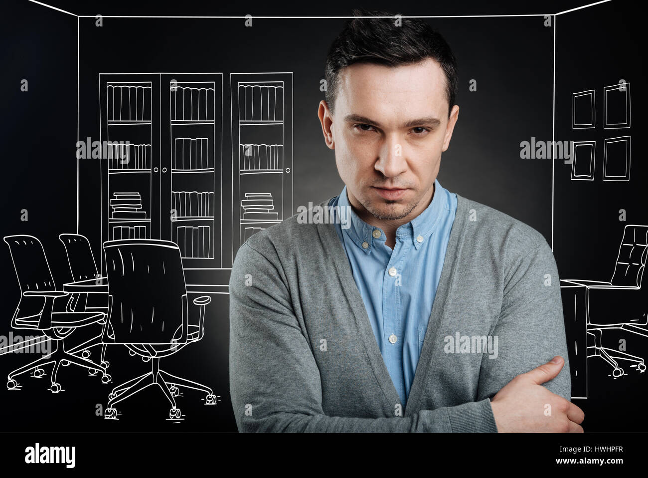 Concentrate on work. Professional serious manager folding his hands and ...