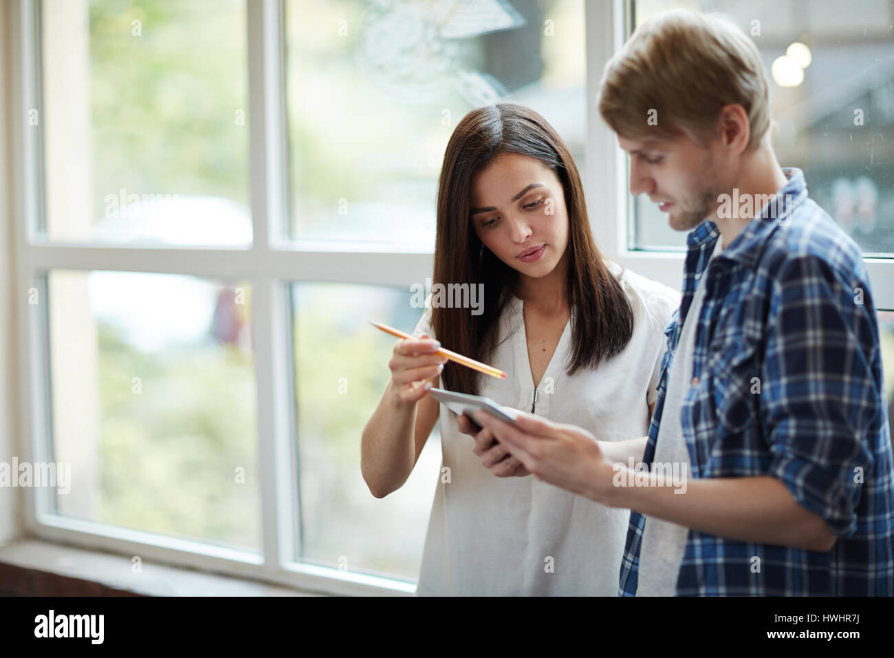 Students of high school searching and discussing information online ...