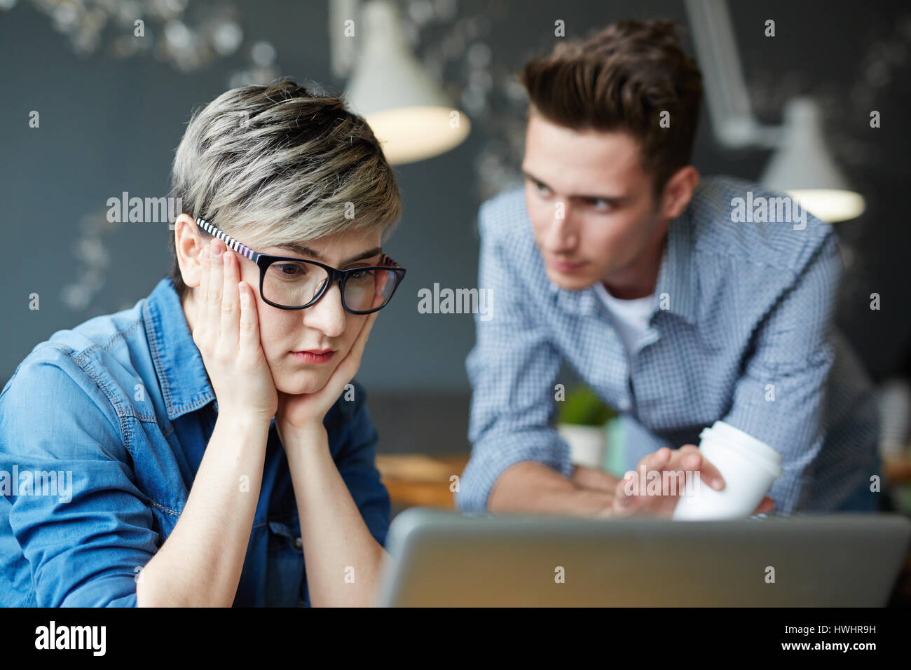 Waist-up portrait of disappointed financial manager looking at computer ...