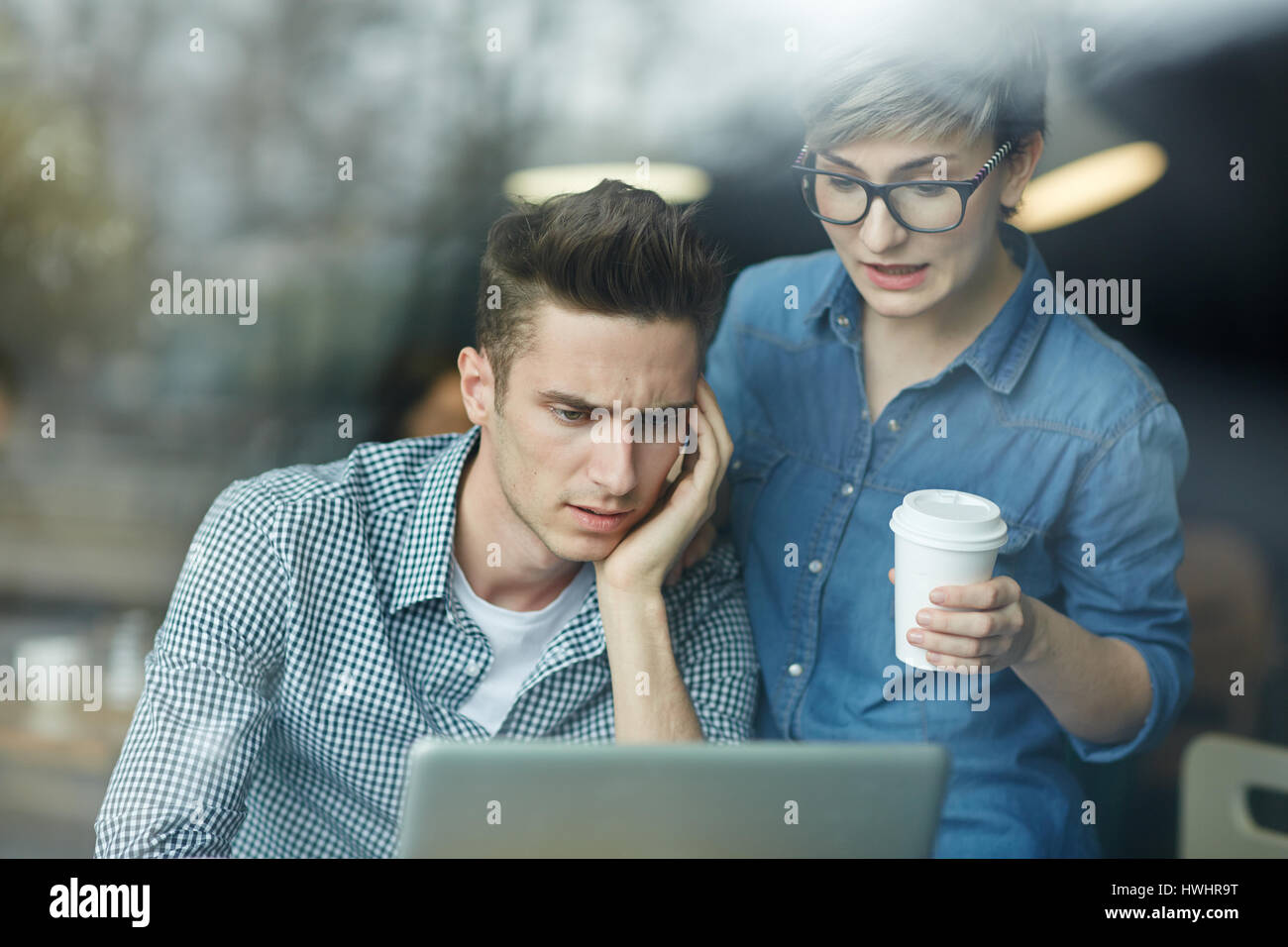 Two young programmers creating new computer application: handsome man ... Two young programmers creating new computer application: handsome man ...