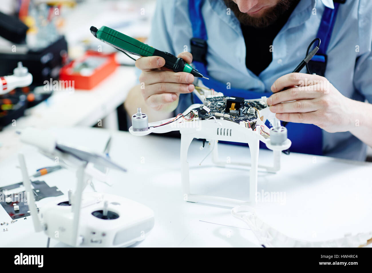 Closeup shot of unrecognizable man testing electric current in circuit ...