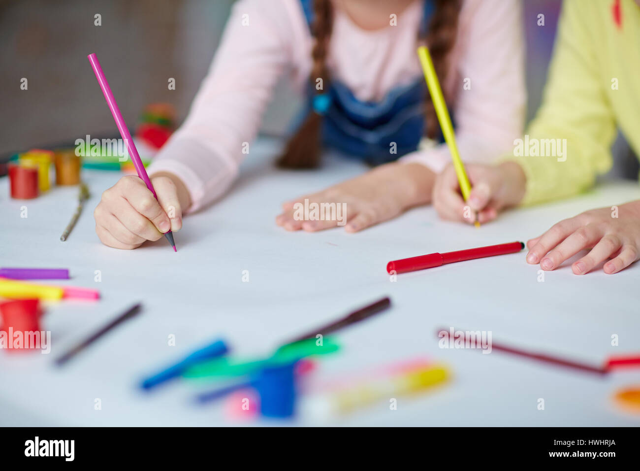 Creative children drawing with multi-color pencils Stock Photo - Alamy