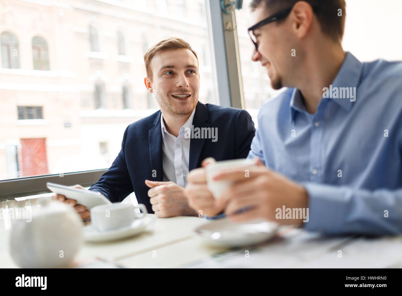 Modern bankers having discussion during business lunch Stock Photo - Alamy