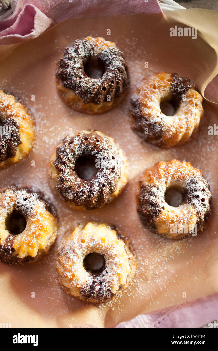 Mini marble bundt cakes with powder sugar Stock Photo - Alamy