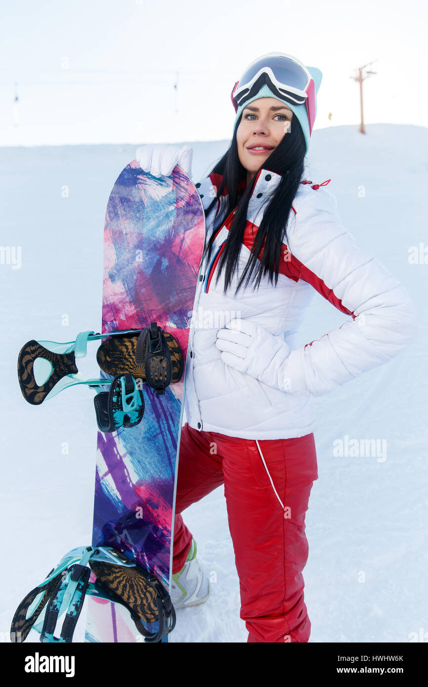 Happy cute female snowboarder hi-res stock photography and images - Alamy