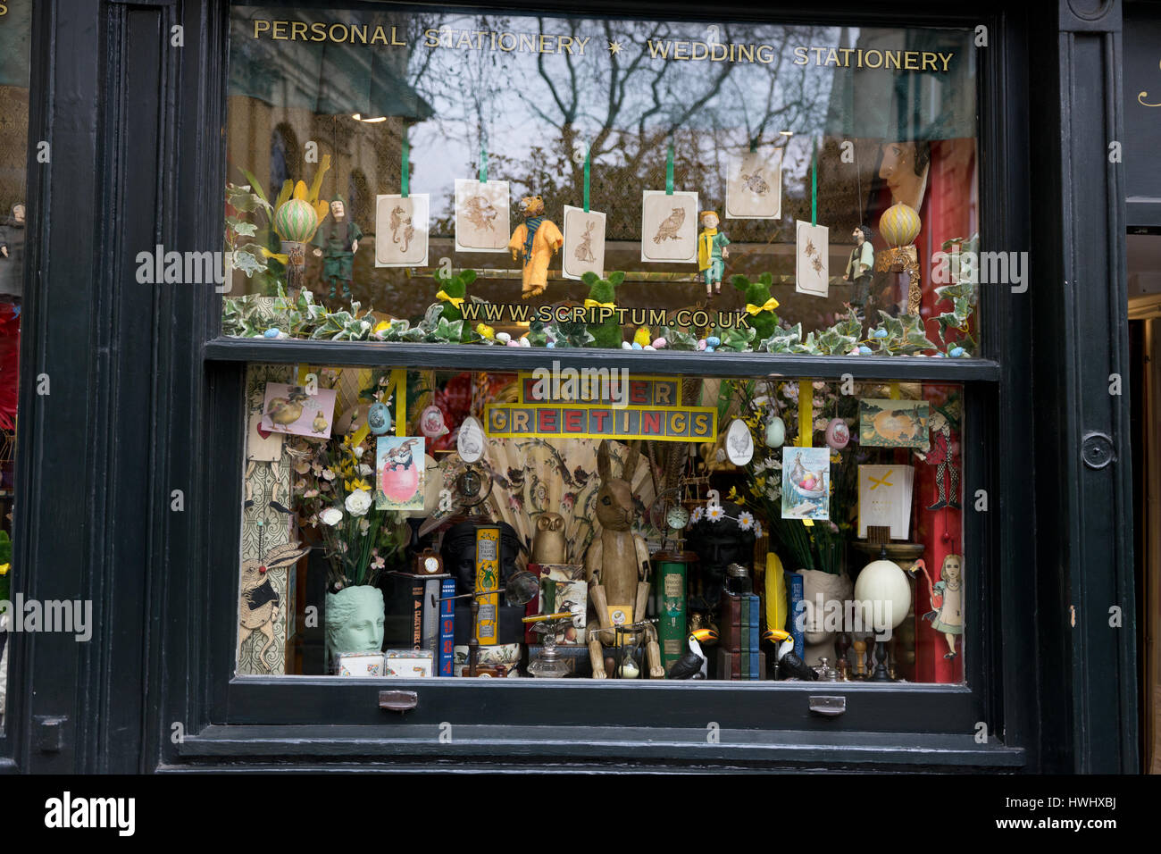 A crazy shop window with many trinkets on display Stock Photo - Alamy