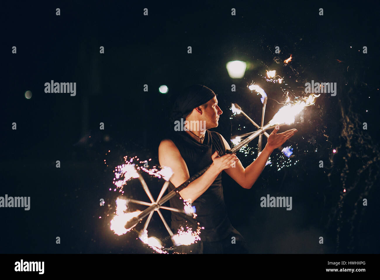 man doing tricks with fire Stock Photo - Alamy