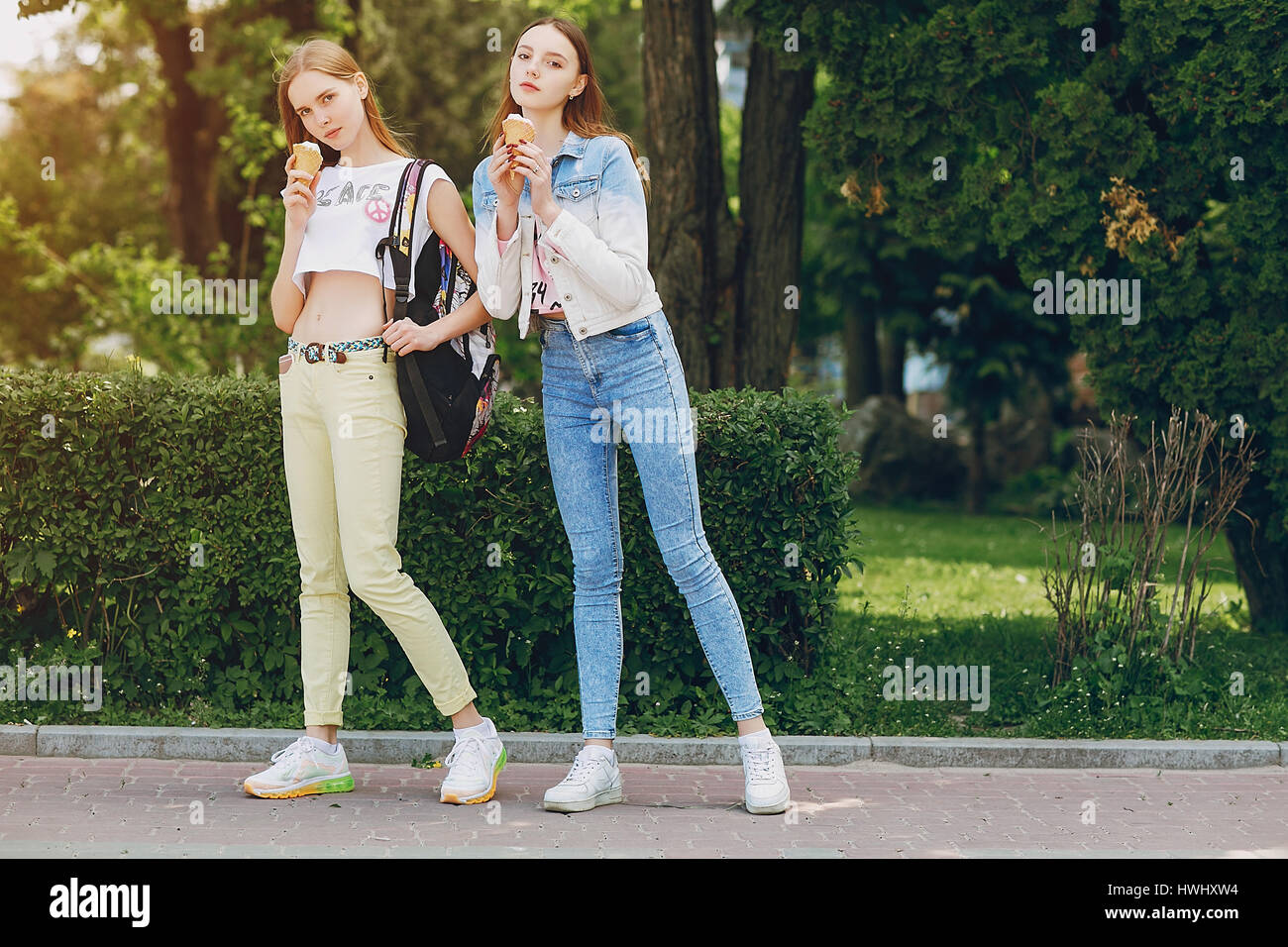 beautiful models pose for a photo in trendy clothes Stock Photo - Alamy