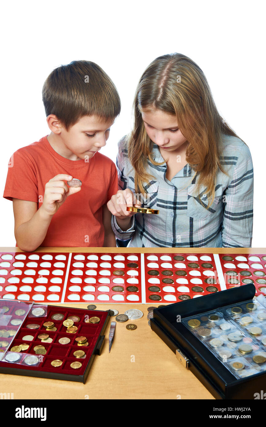 Boy and girl are considering coin collection isolated white Stock Photo ...
