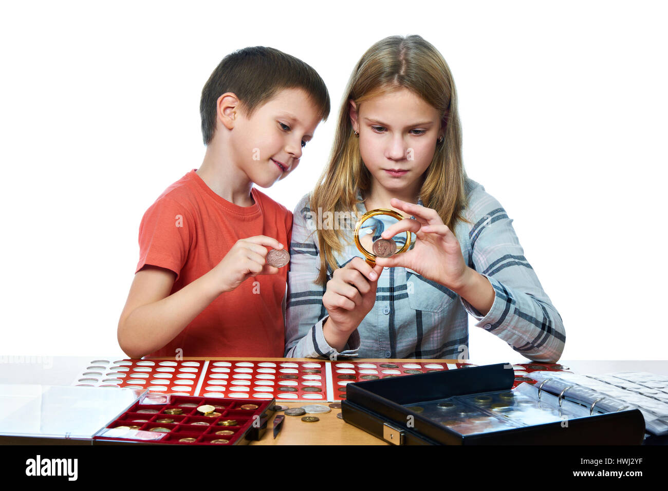 Boy and girl are considering coin collection isolated white Stock Photo ...