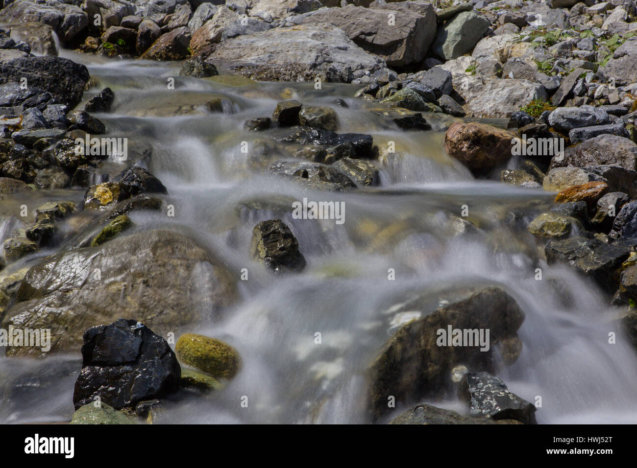 natural floating water in a natural mountain stream with stones Stock ...