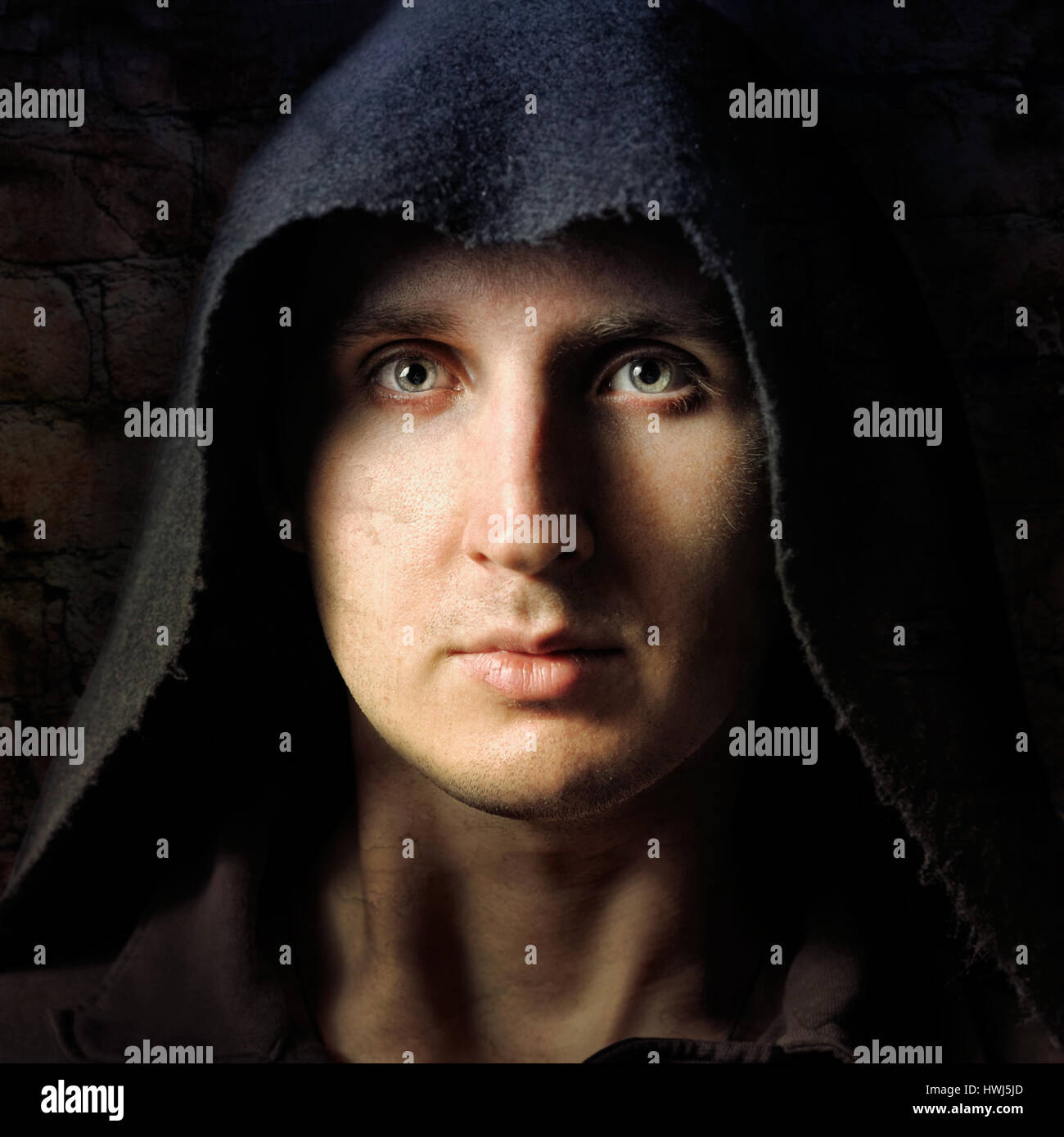 Spooky man in black hood Stock Photo - Alamy