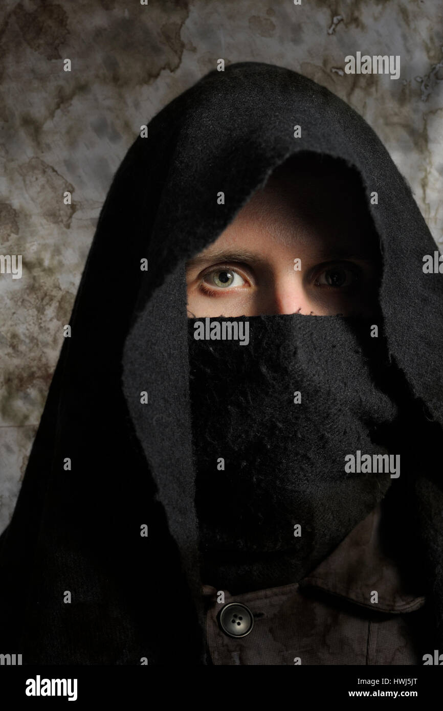 Portrait of assassin in darkness Stock Photo - Alamy