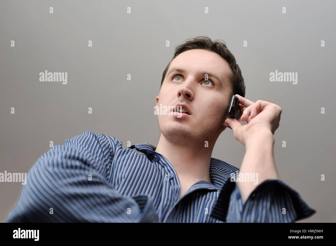 Man with mobile phone in hand Stock Photo - Alamy