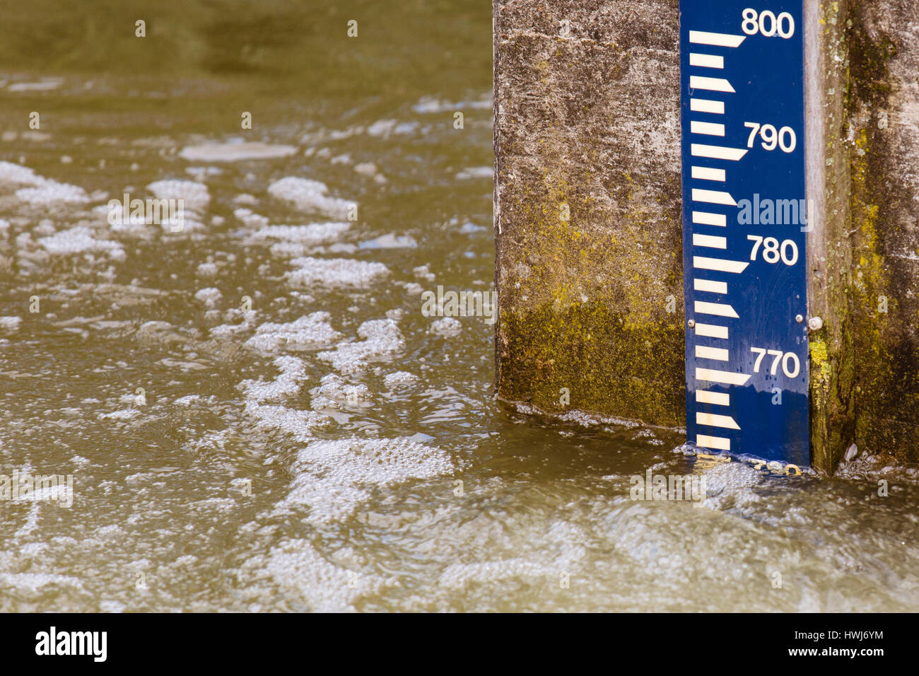 water level meter on a concrete wall in river Stock Photo - Alamy