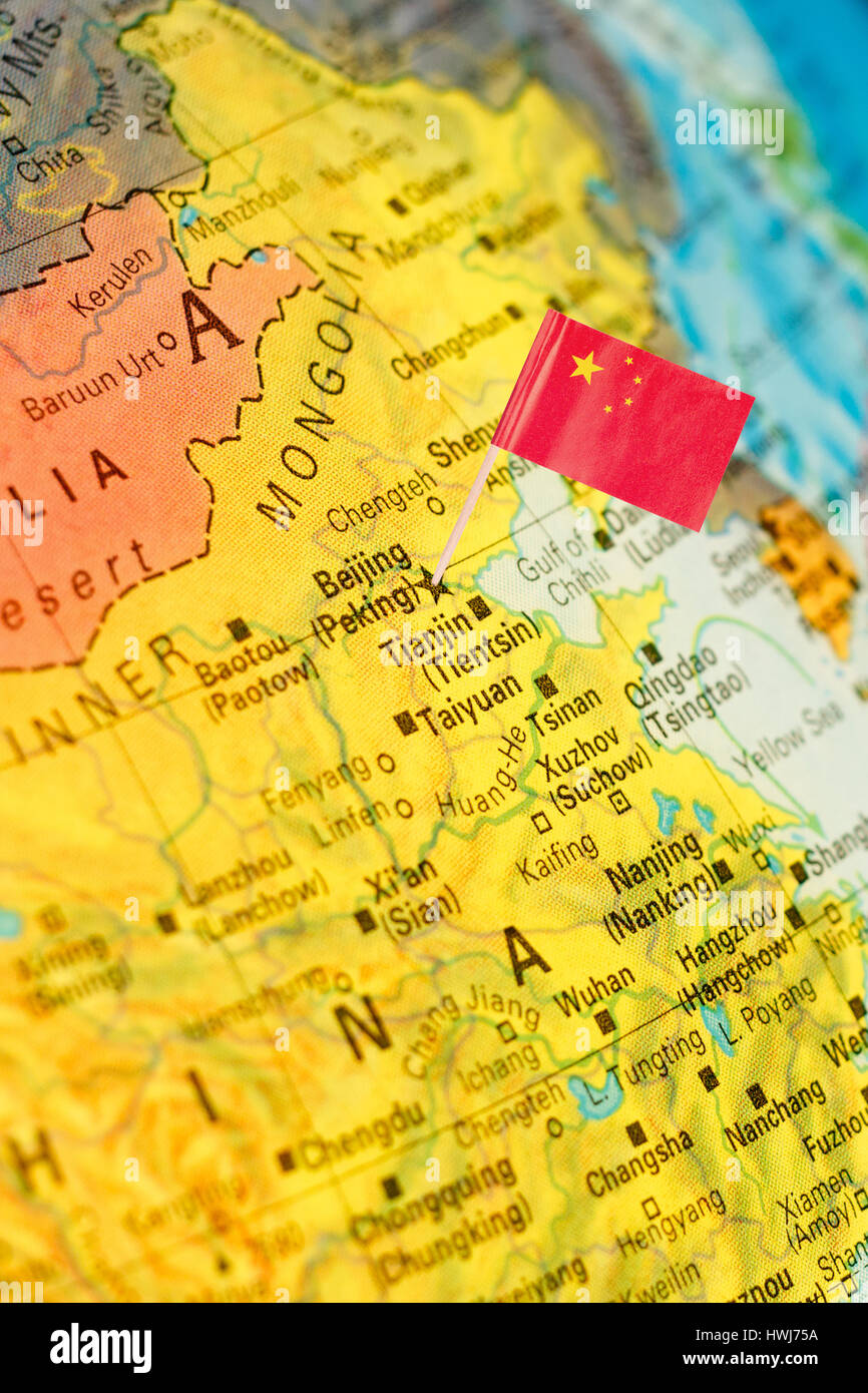map with miniature flag of China.Selective focus on Chinese Flag ...