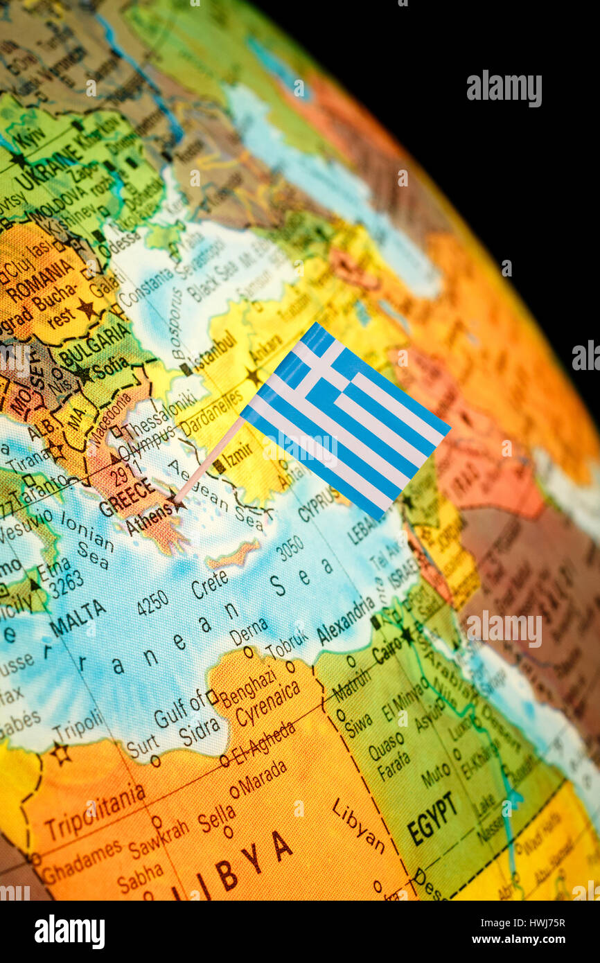 map with miniature flag of Greece .Selective focus on Greek Flag ...