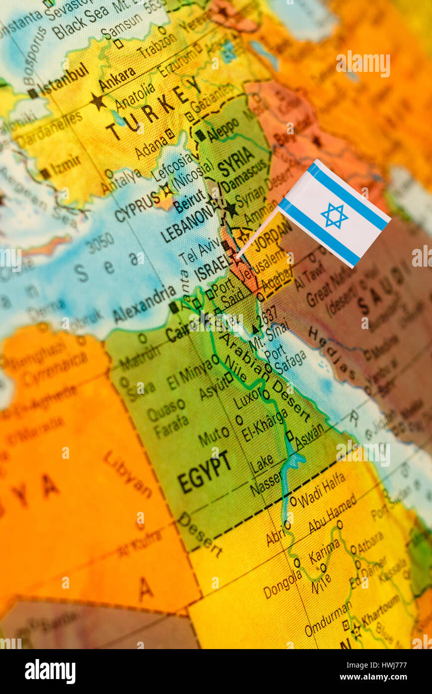 map with miniature flag of Israel .Selective focus on Israeli Flag ...