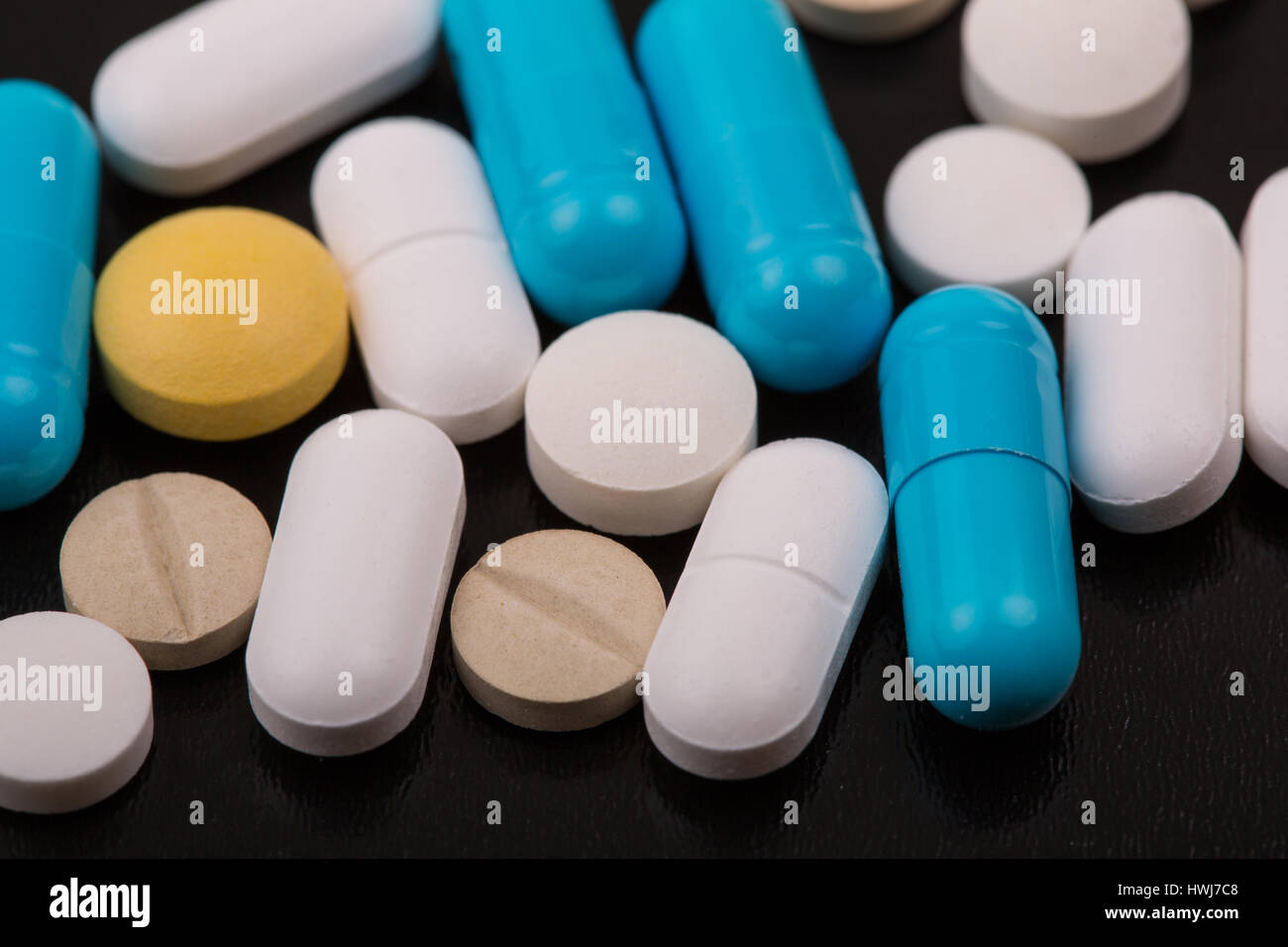 different tablets pills capsule heap mix therapy drugs Stock Photo - Alamy