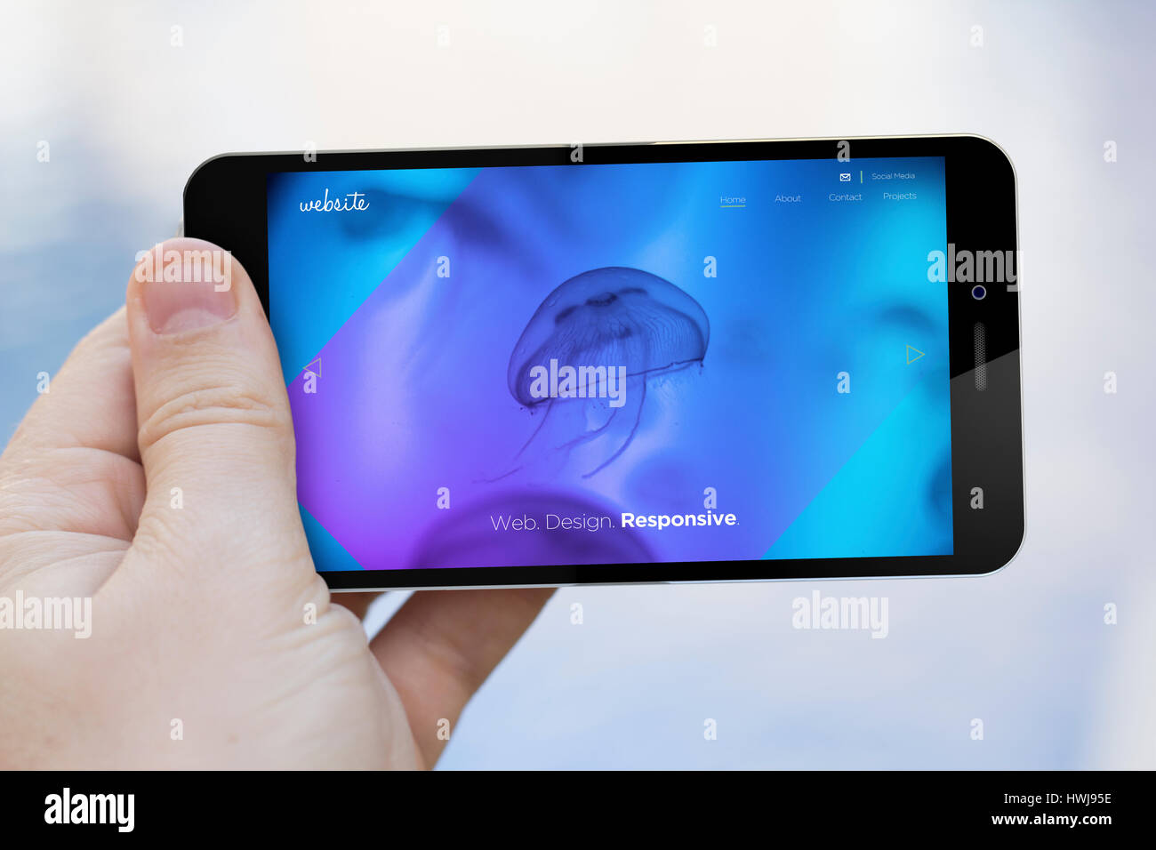 mobile design concept: hand holding a cool design website on smartphone ...