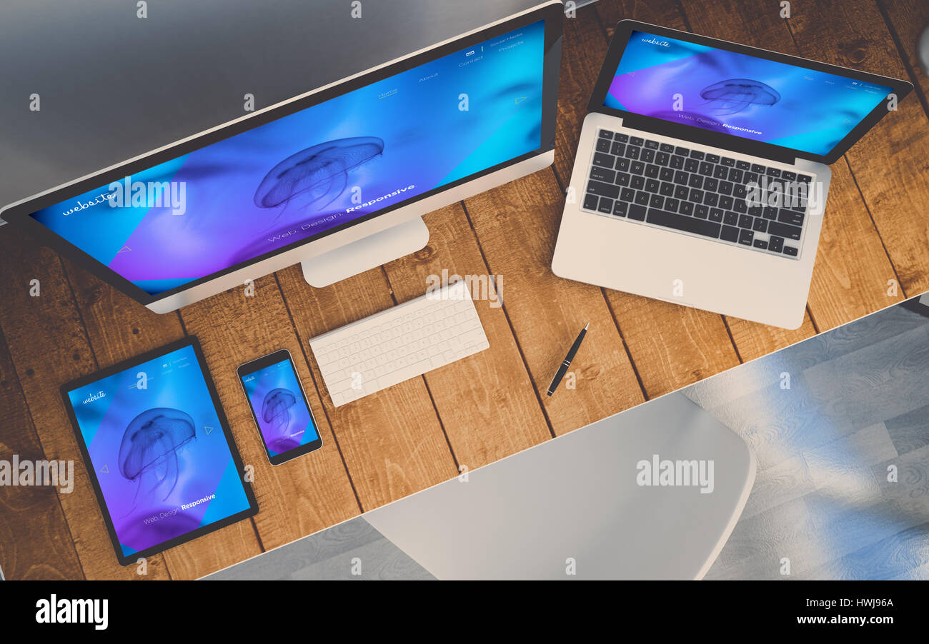 top view of a computer, laptop, smartphone and tablet on a desktop ...