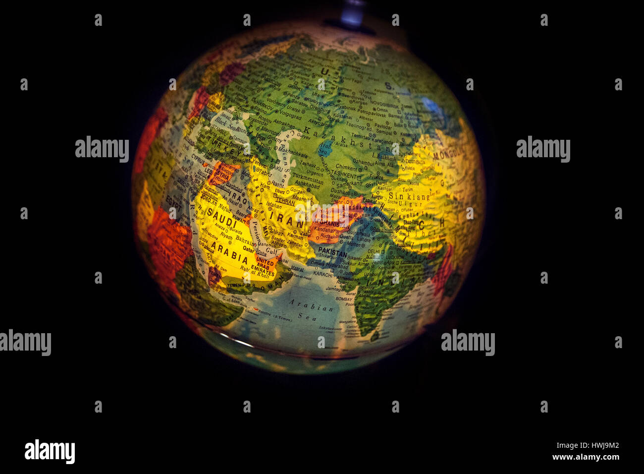 close up of old fashioned world globe a ball shaped map lit from within ...