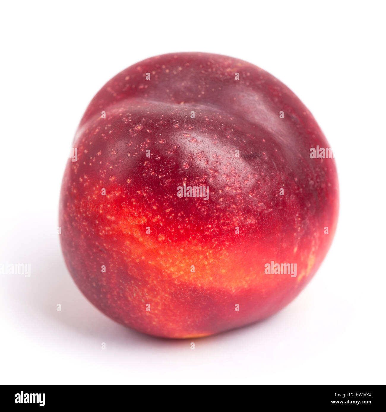 One nectarine isolated on white background Stock Photo - Alamy