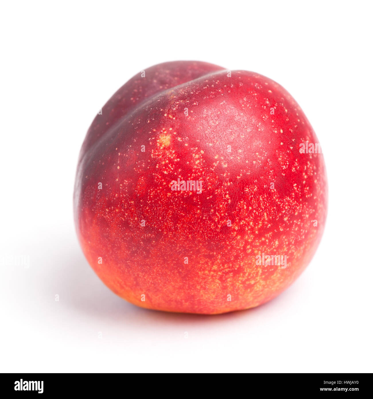 One nectarine isolated on white background Stock Photo - Alamy