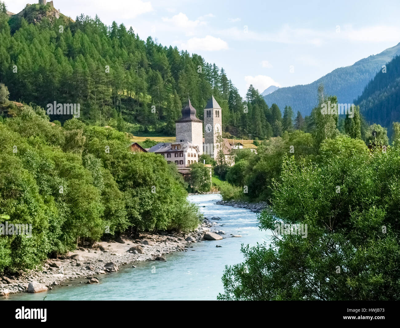 Susch, Switzerland - July 12, 2015: Bell tower of the church tower near ...