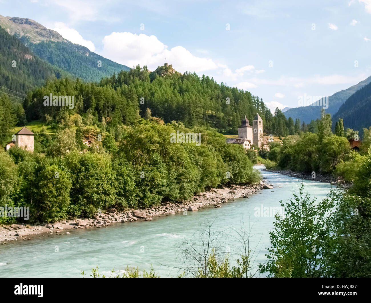 Susch, Switzerland - July 12, 2015: Bell tower of the church tower near ...