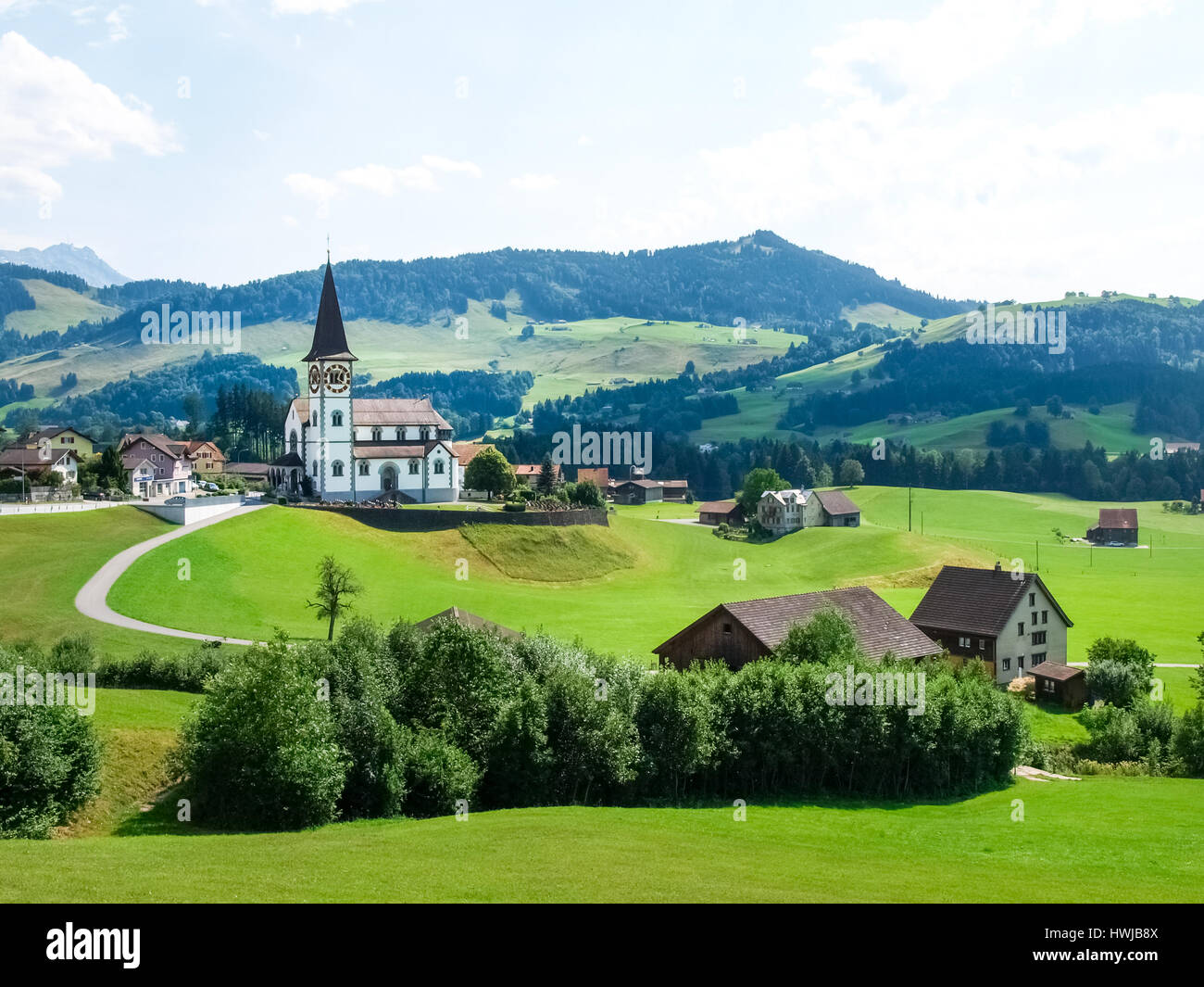 Switzerland: Swiss panorama. country church with Hills in the ...