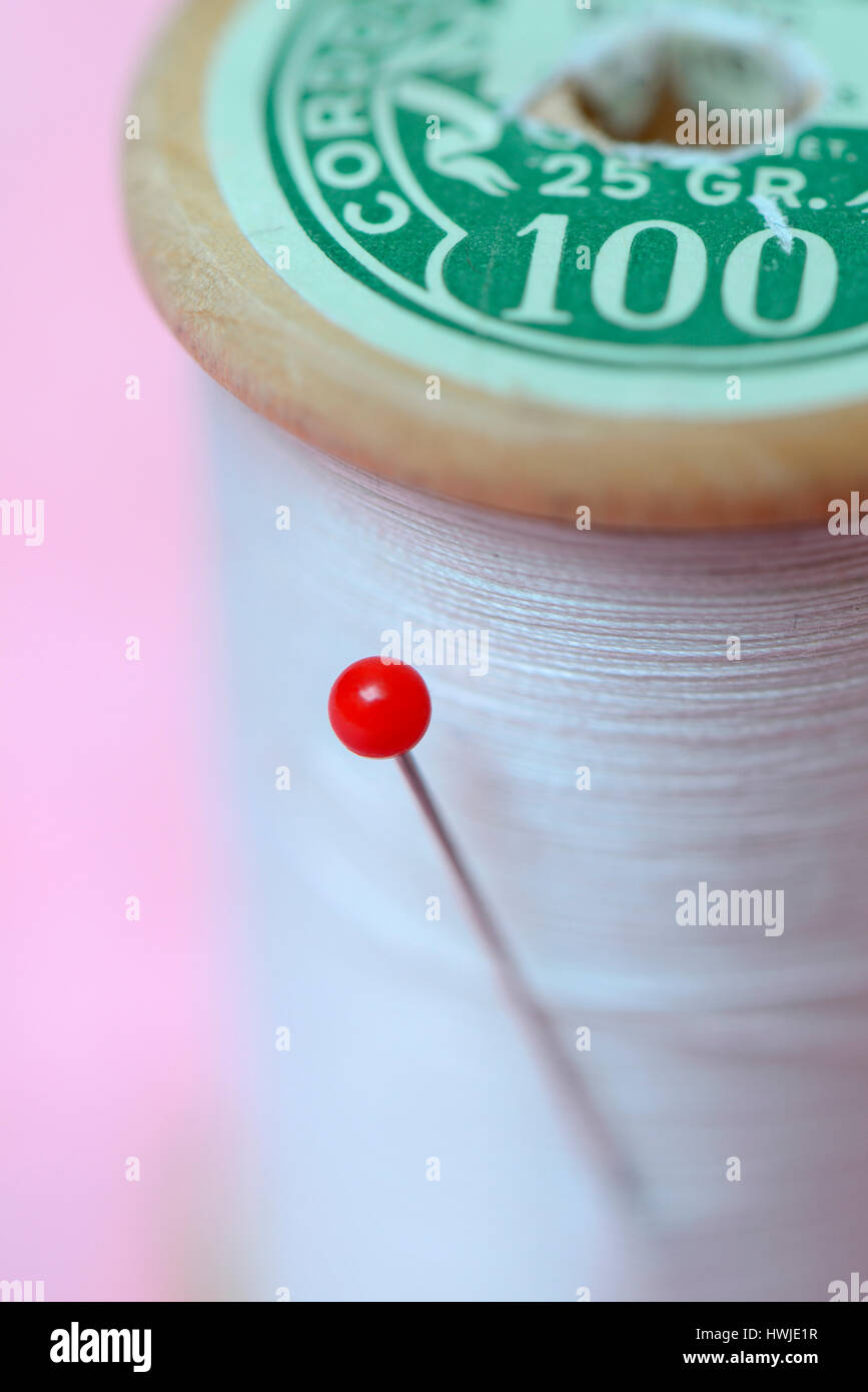 pin and cotton reel Stock Photo - Alamy