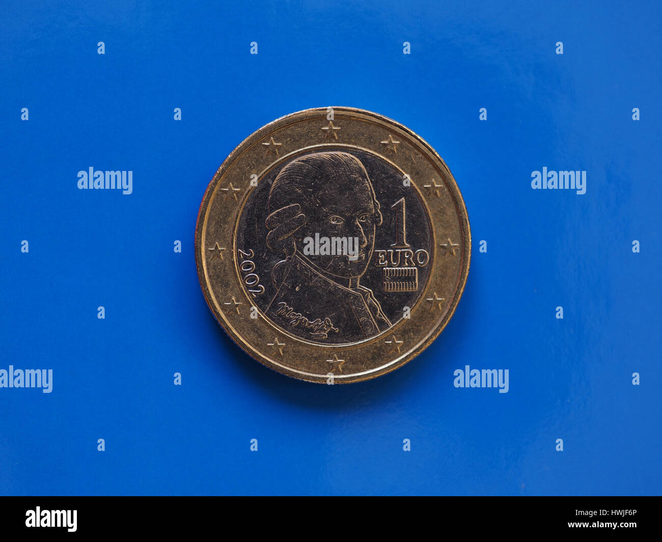 1 euro coin money (EUR), currency of European Union, Austria over blue ...