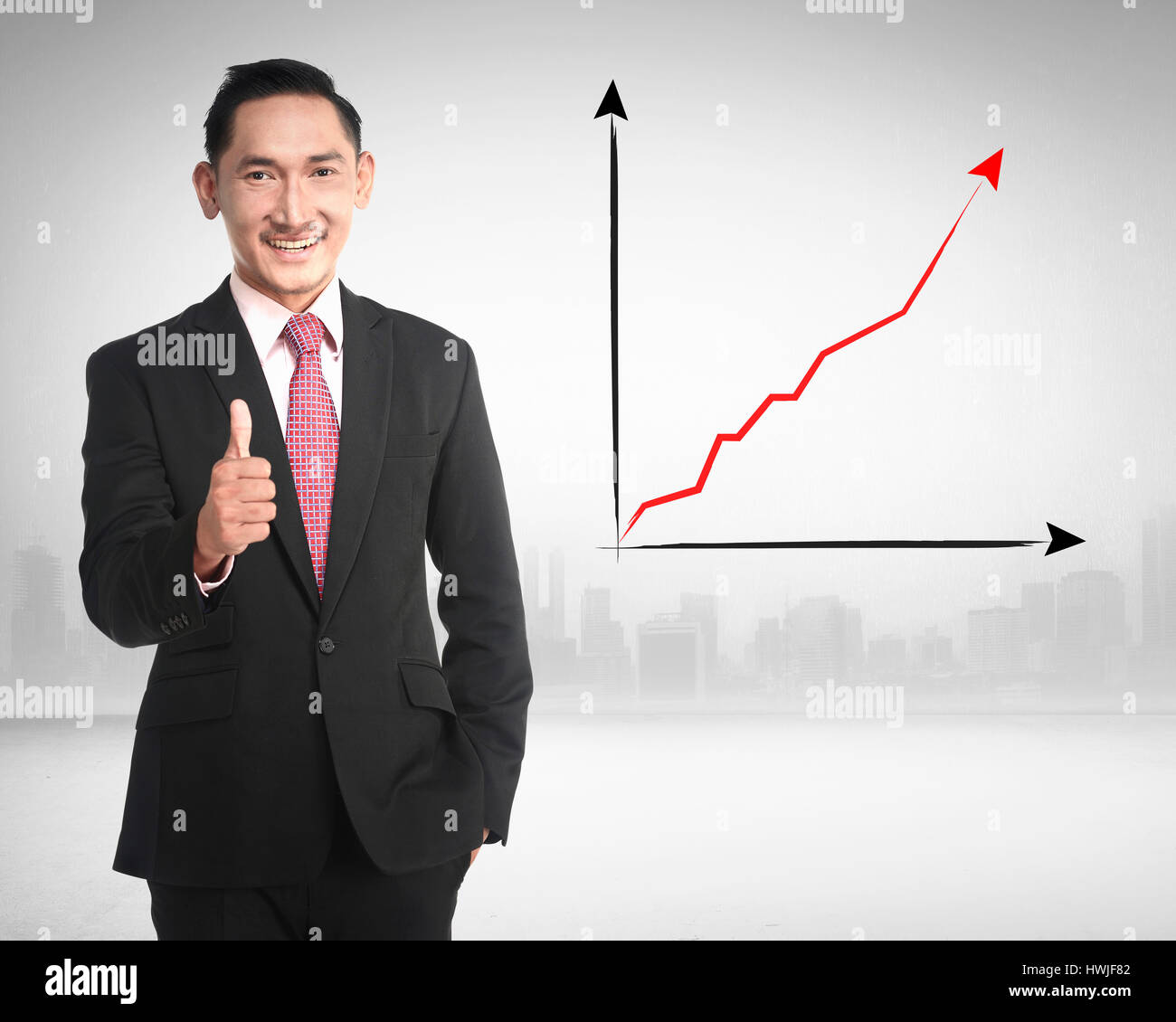 Asian business man show thumb up because sales increasing Stock Photo ...