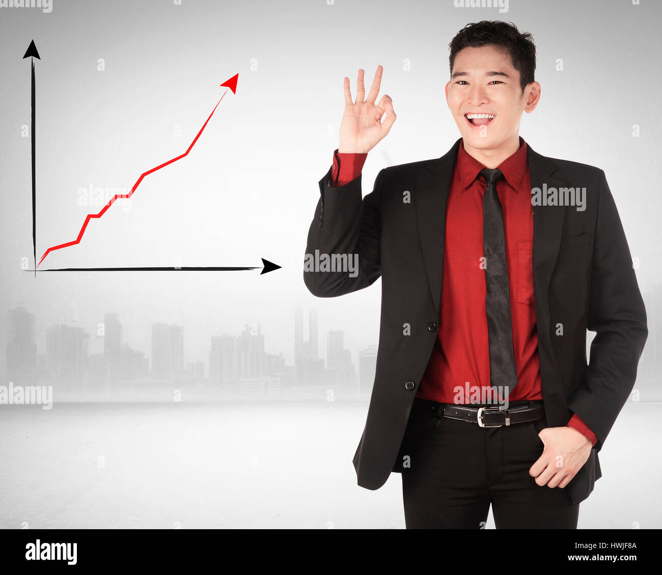 Asian business man give hand gesture OK with increase chart background ...