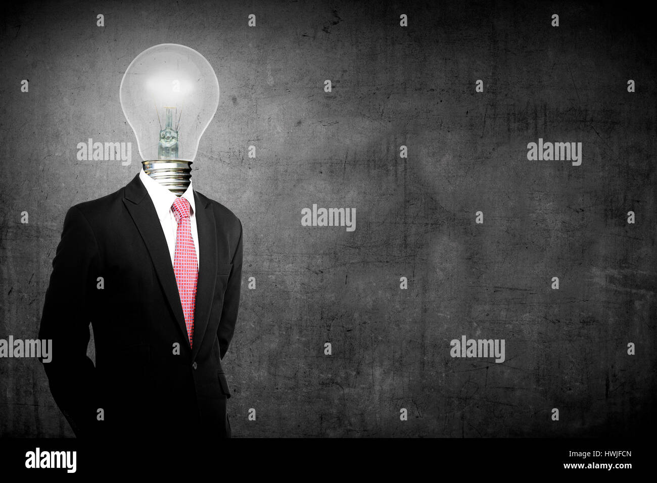 Business man with lamp head wearing suit and tie Stock Photo - Alamy
