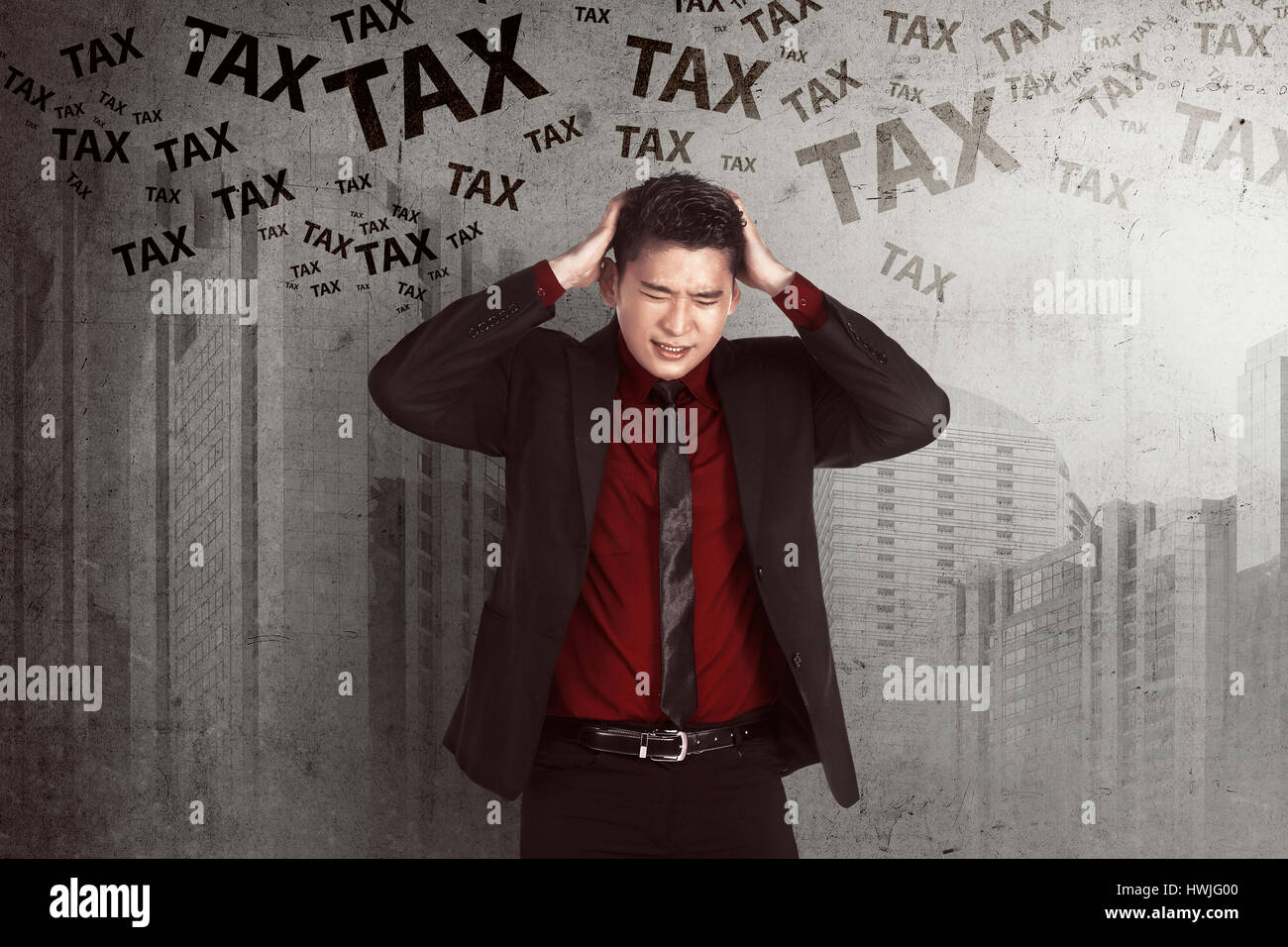 Asian business person thinking hard about tax. Taxation concept Stock ...