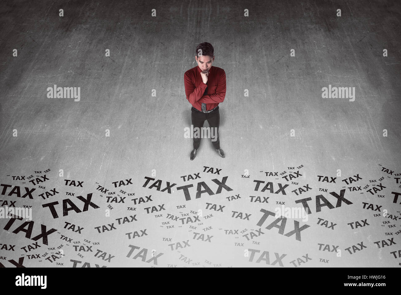 Asian business man looking tax writing on the floor Stock Photo - Alamy