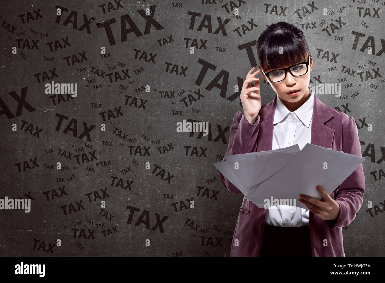Asian business person thinking hard about tax. Taxation concept Stock ...