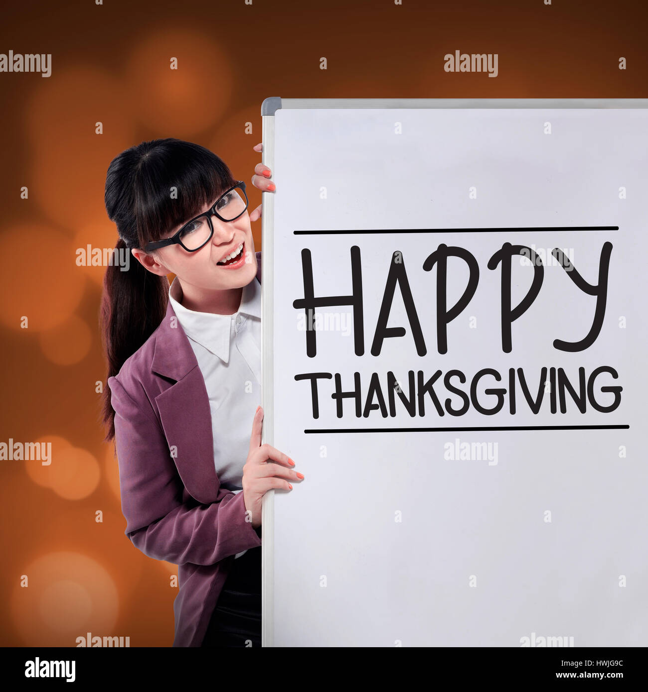 Asian woman smiling show happy thanksgiving writing on the whiteboard ...