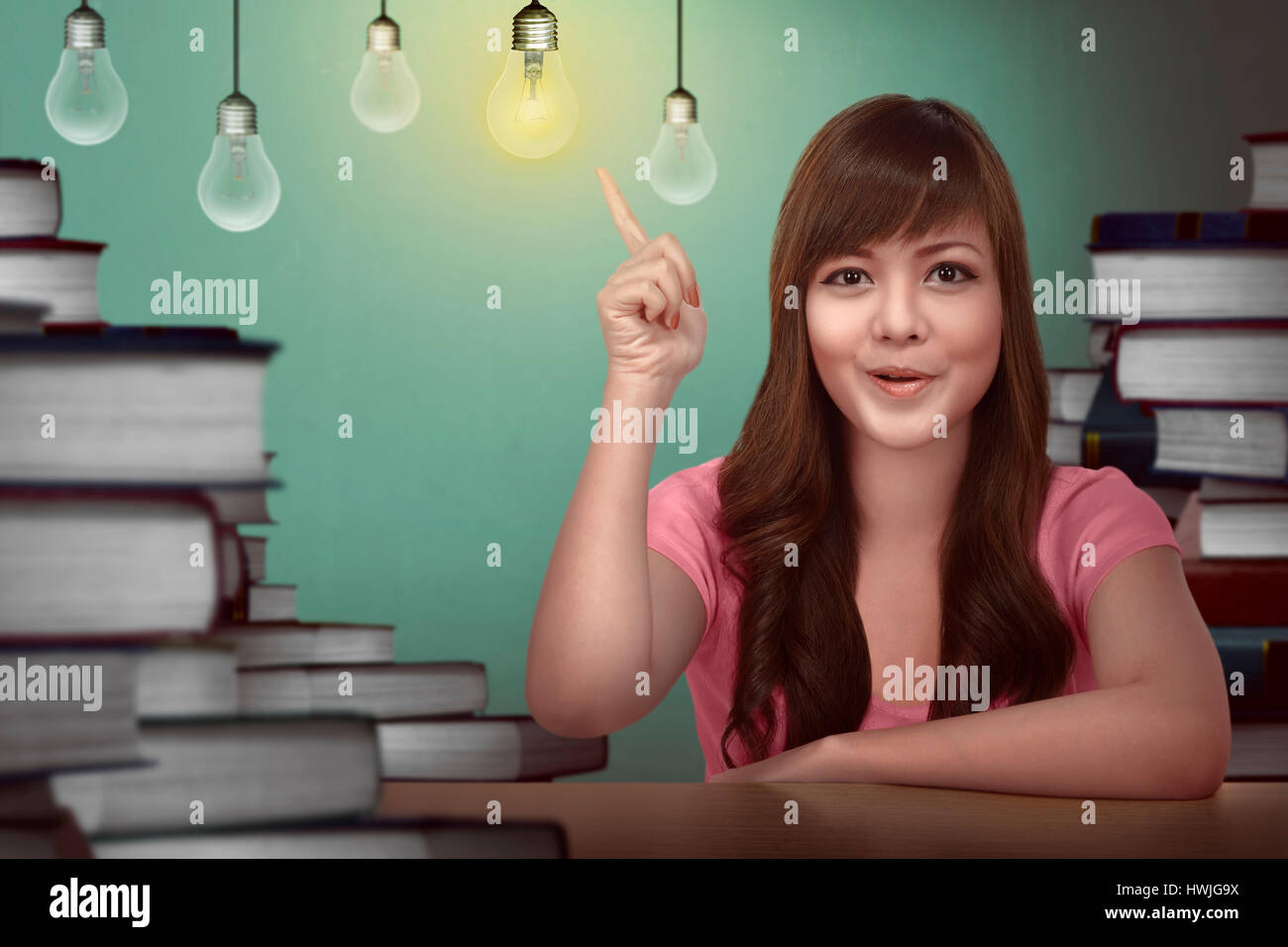 Asian female student having idea with blackboard background Stock Photo ...