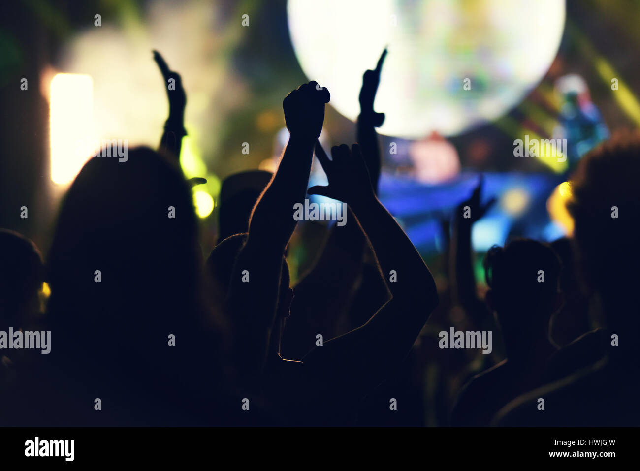 Crowd rocking during a concert with raised arms. Toned image Stock ...