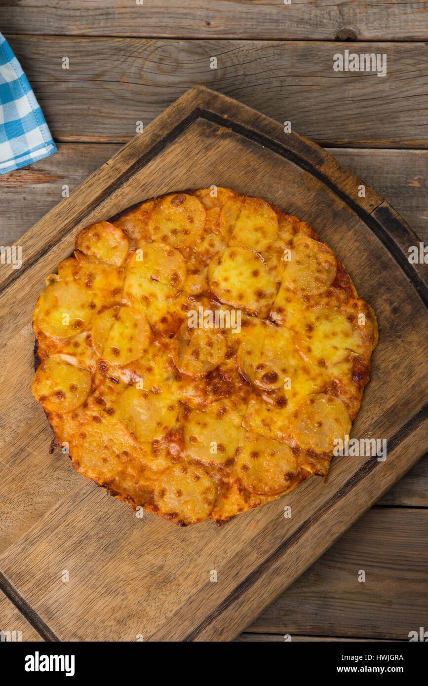 pepperoni pizza with rustic background top down view Stock Photo - Alamy