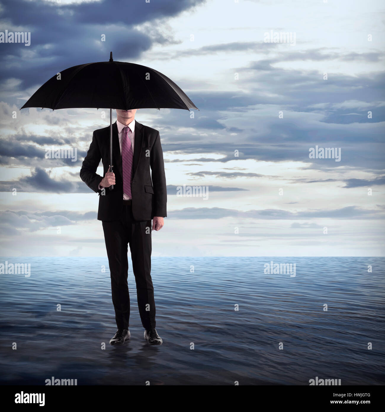 Man holding umbrella in rain hi-res stock photography and images - Alamy